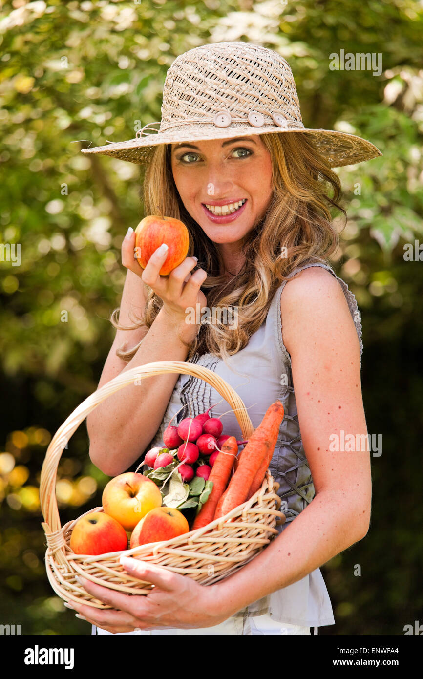 Woman with fruits and vegetables from garden Stock Photo - Alamy