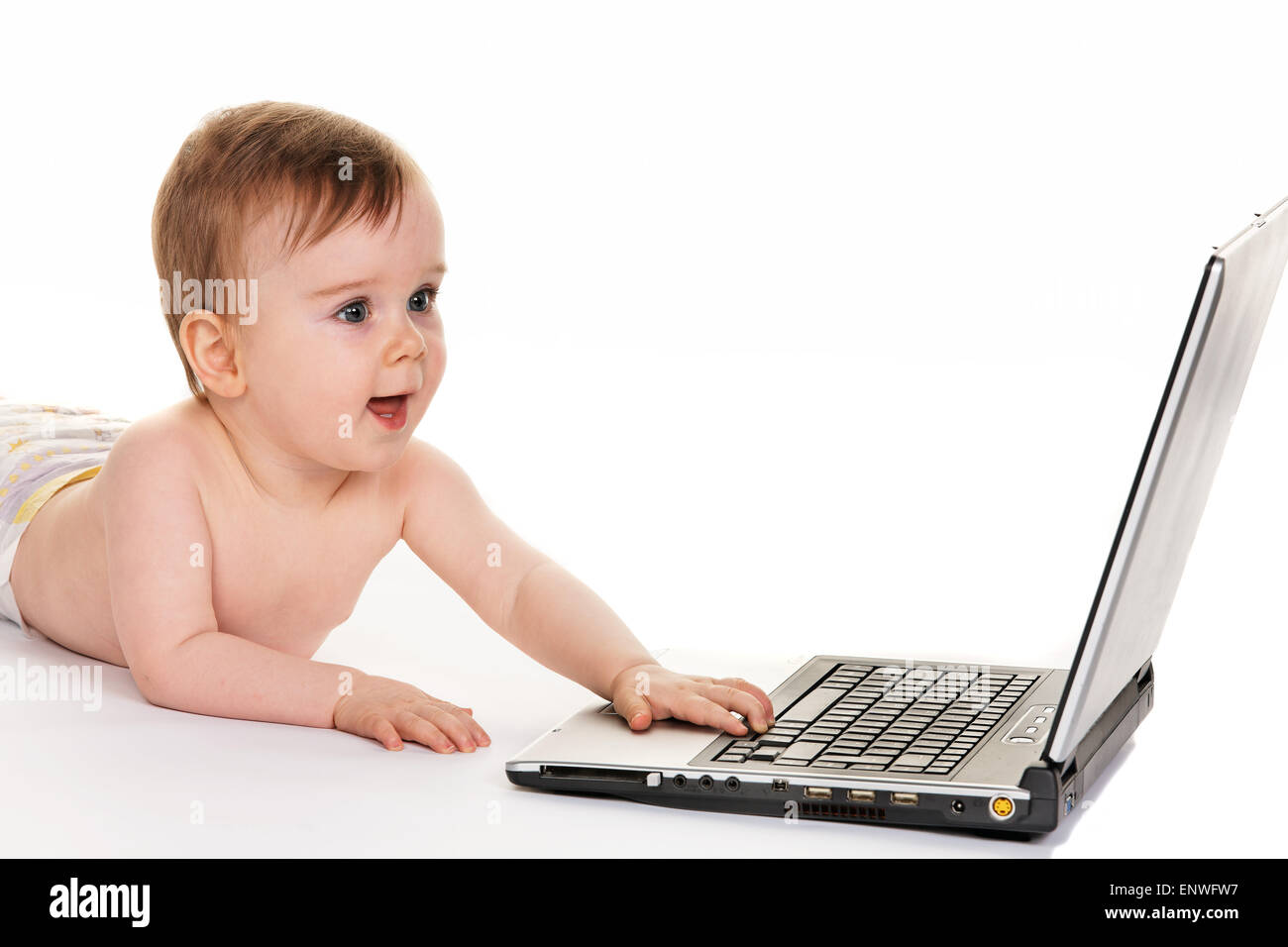 Baby playing with laptop Stock Photo - Alamy