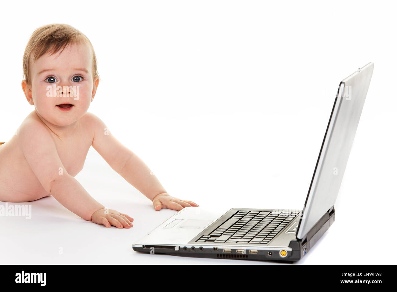 Baby playing with laptop Stock Photo - Alamy