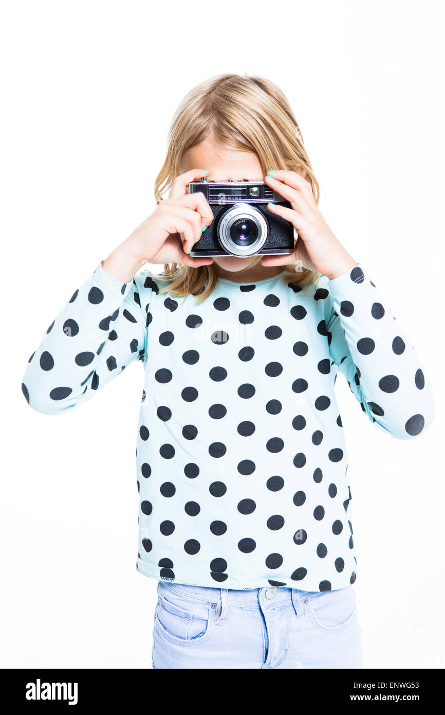Girl photographing with an old film camera Stock Photo - Alamy
