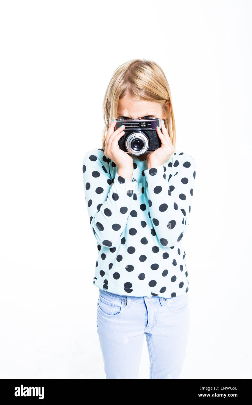 Girl photographing with an old film camera Stock Photo - Alamy