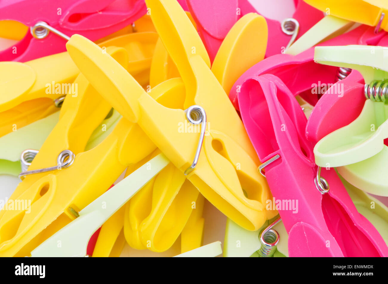 Pegs of various colors arranged as background Stock Photo - Alamy
