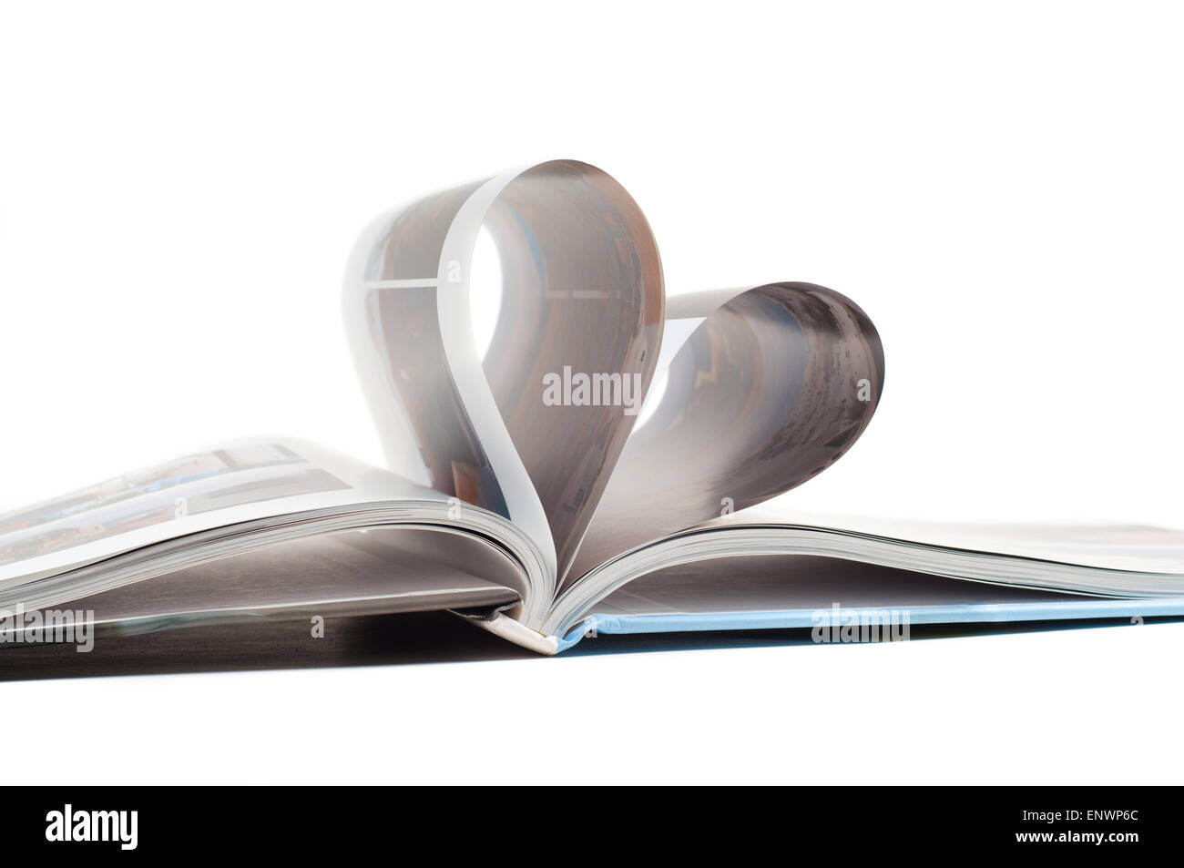 Heart in book Stock Photo - Alamy