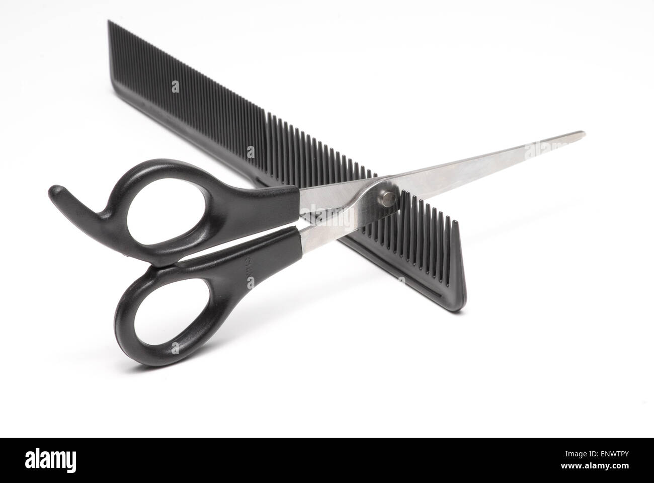 Barber cutting hair Cut Out Stock Images & Pictures - Alamy