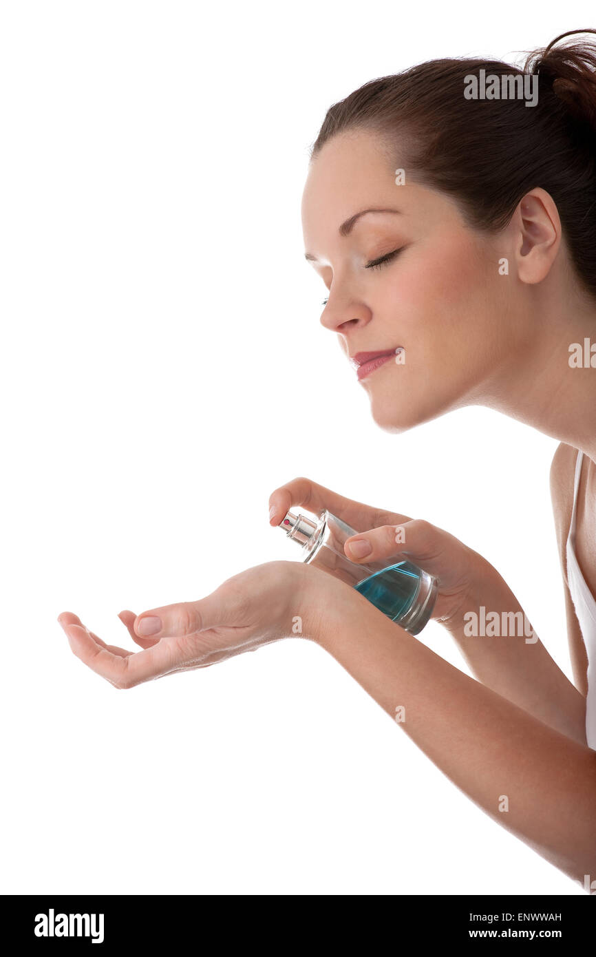 Body care series - Beautiful woman applying perfume Stock Photo - Alamy