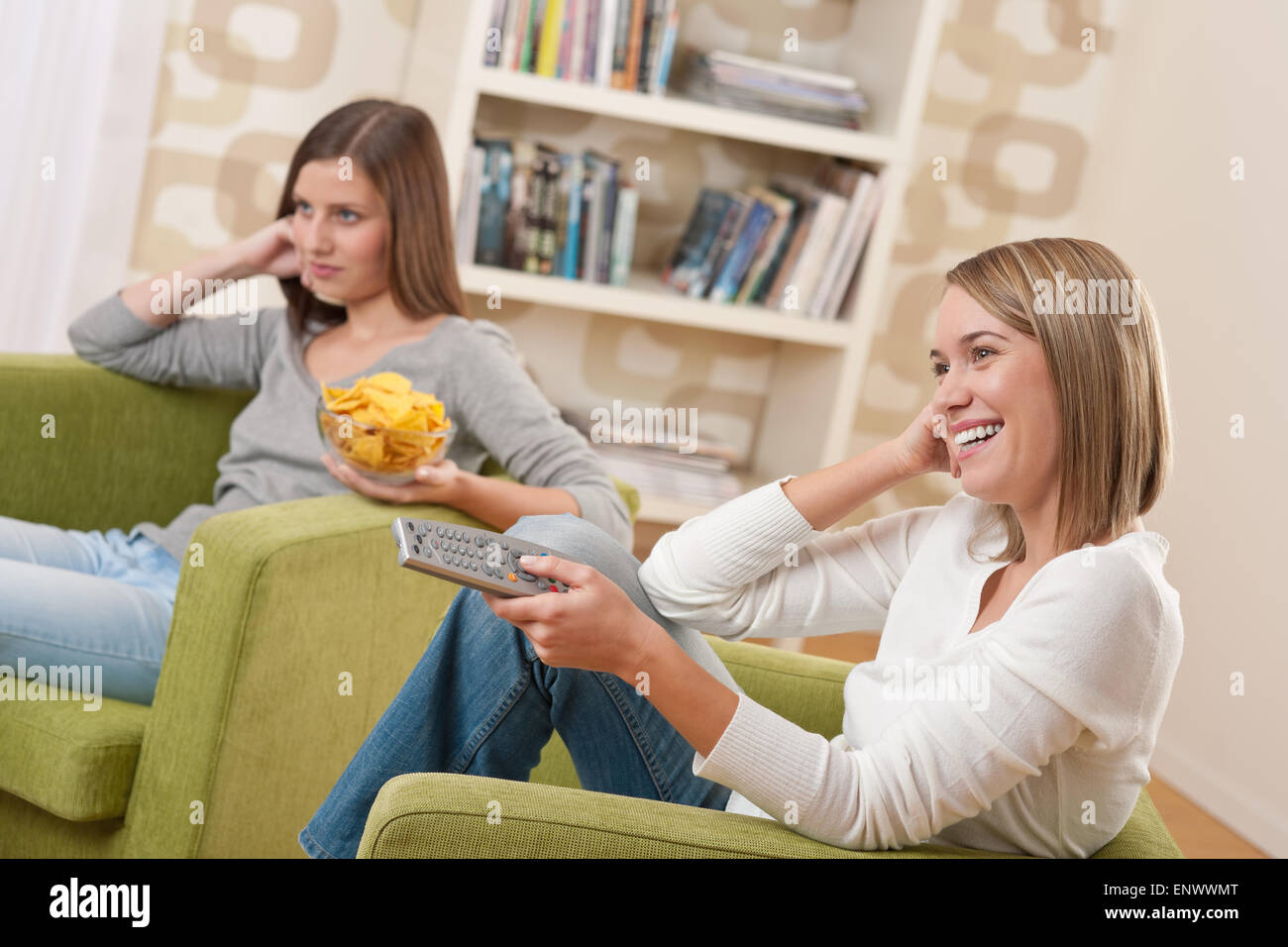 Students - Two female teenager watching television Stock Photo - Alamy