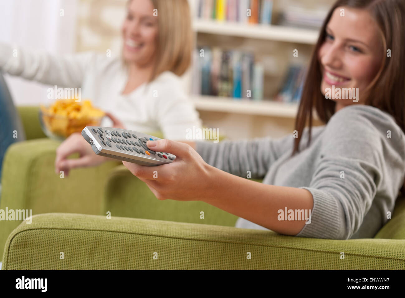 Students - Two female teenager watching television Stock Photo - Alamy