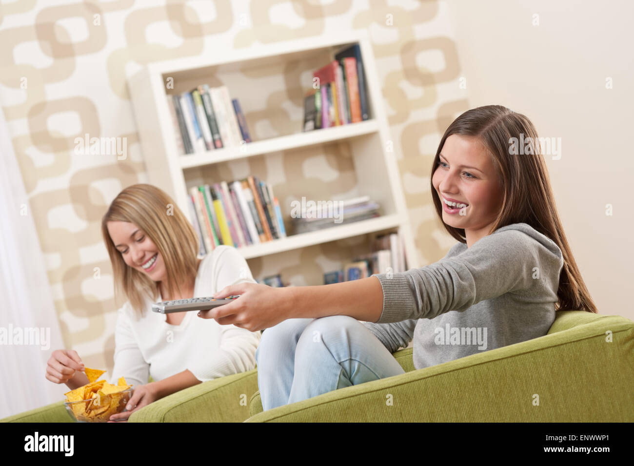 Students - Two female teenager watching television Stock Photo - Alamy