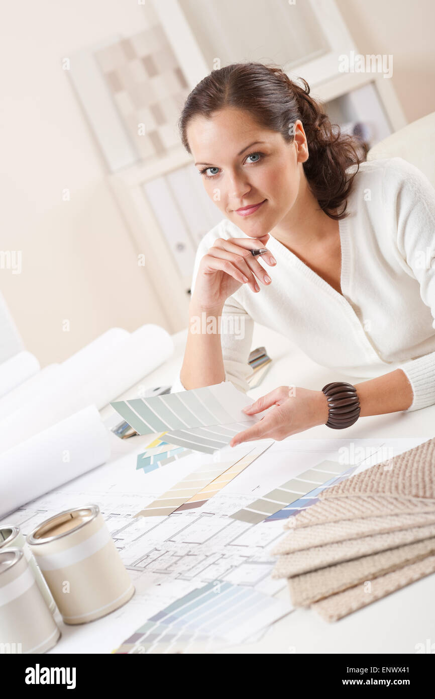 Young female interior designer working at office Stock Photo - Alamy