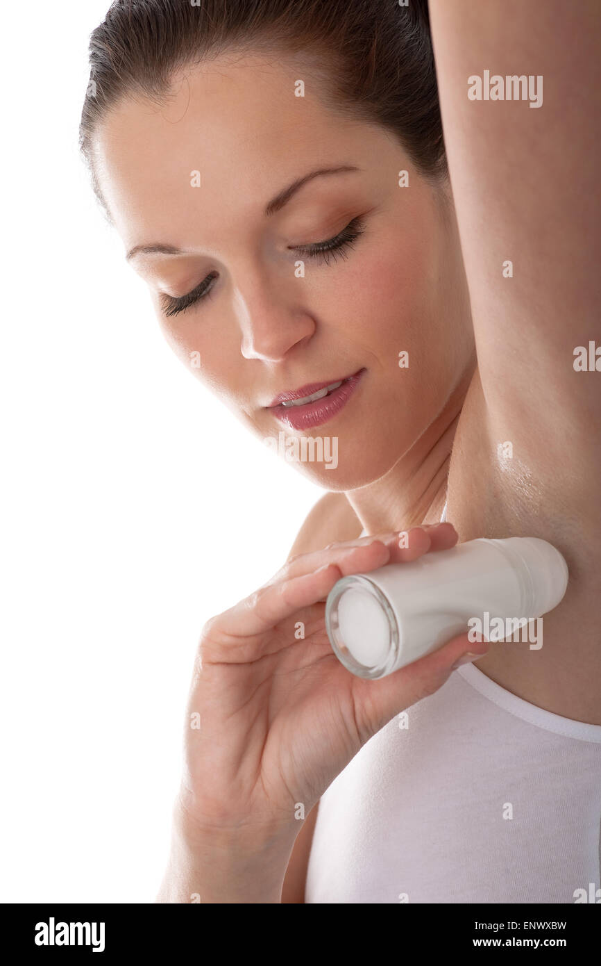 Body care series - Young woman applying deodorant Stock Photo - Alamy