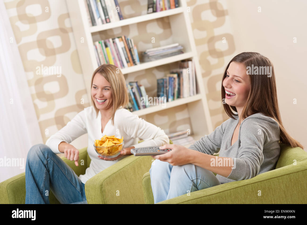 Students - Two female teenager watching television Stock Photo - Alamy
