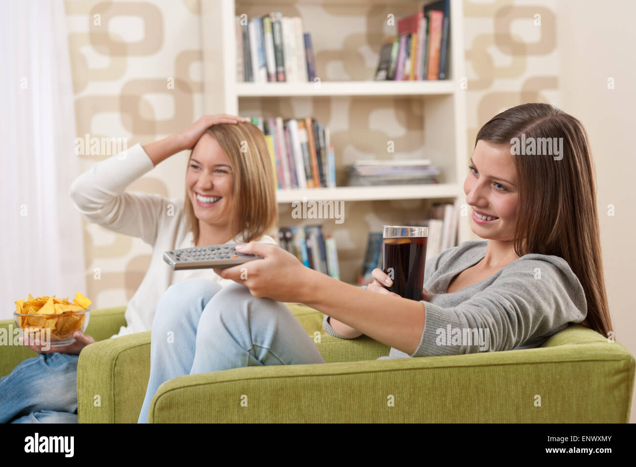 Students - Two female teenager watching television Stock Photo - Alamy