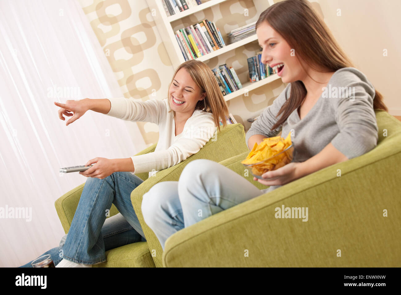 Students - Two female teenager watching television Stock Photo - Alamy