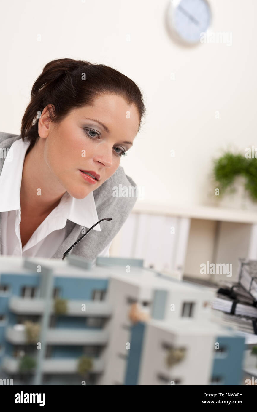 Portrait of female architect with architectural model Stock Photo - Alamy