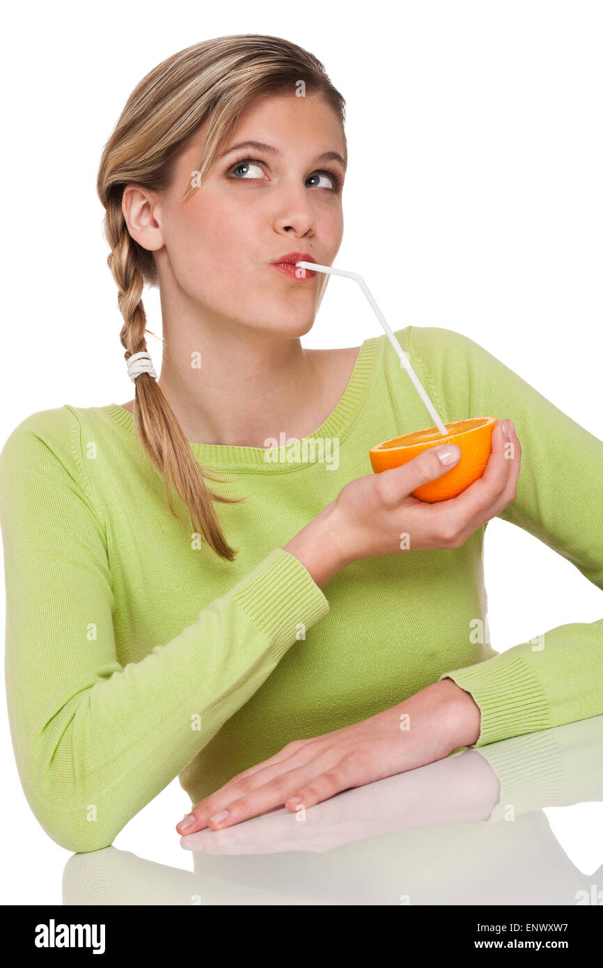 Healthy lifestyle series - Woman drinking orange Stock Photo - Alamy