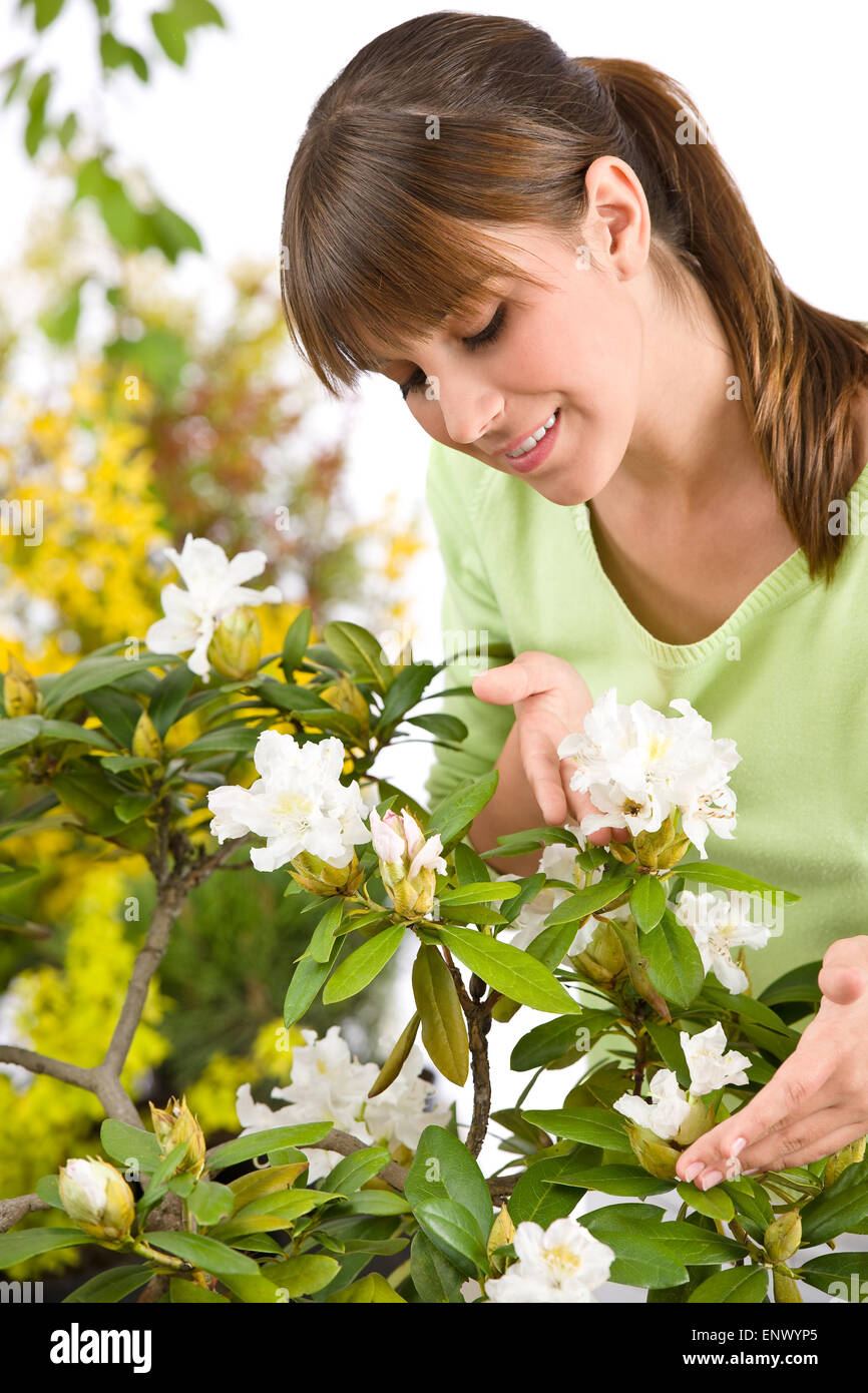 Gardening - Portrait of woman with Rhododendron flower Stock Photo - Alamy