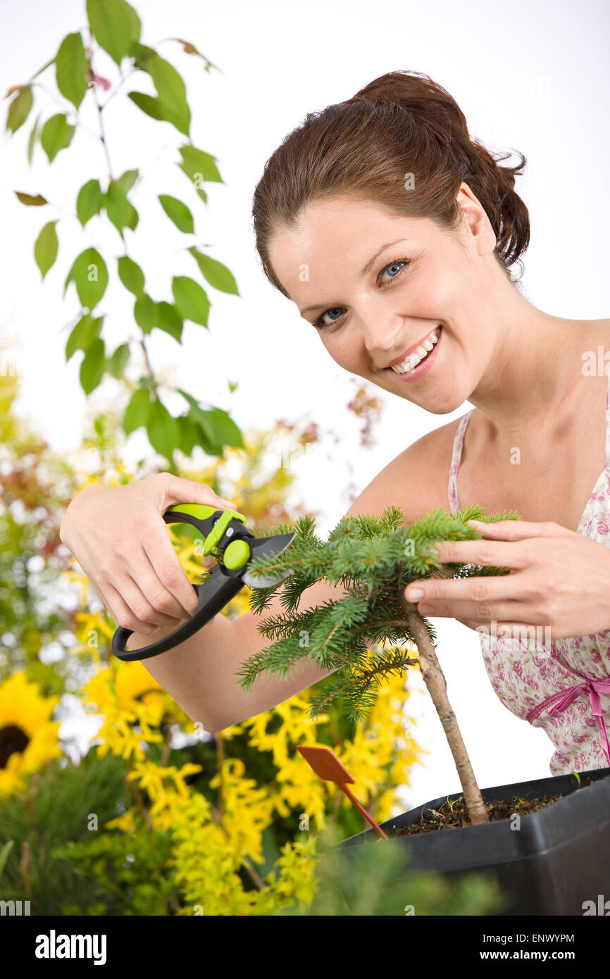 Gardening - woman cutting tree with pruning shears Stock Photo - Alamy