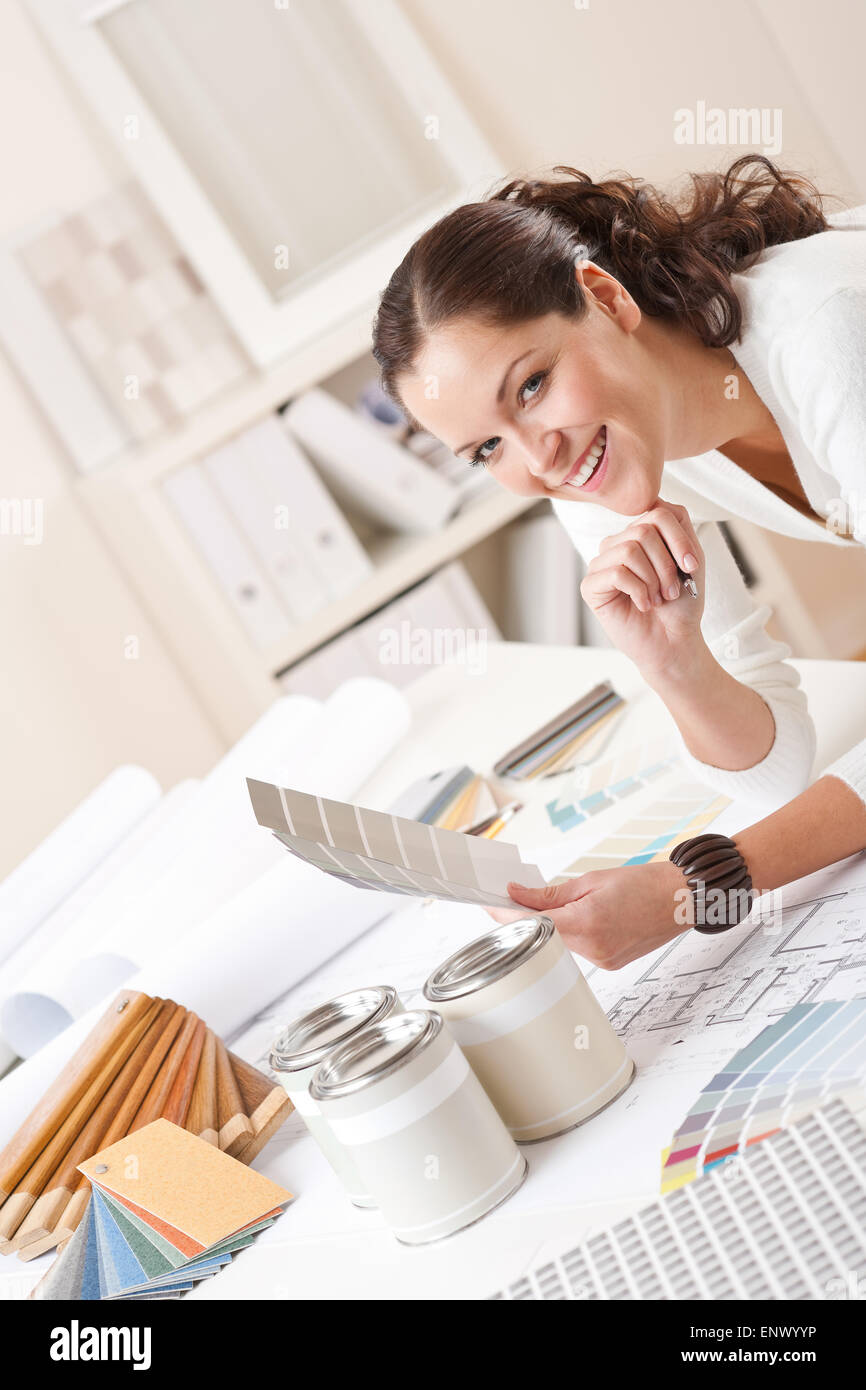 Young female interior designer at office with paint Stock Photo - Alamy
