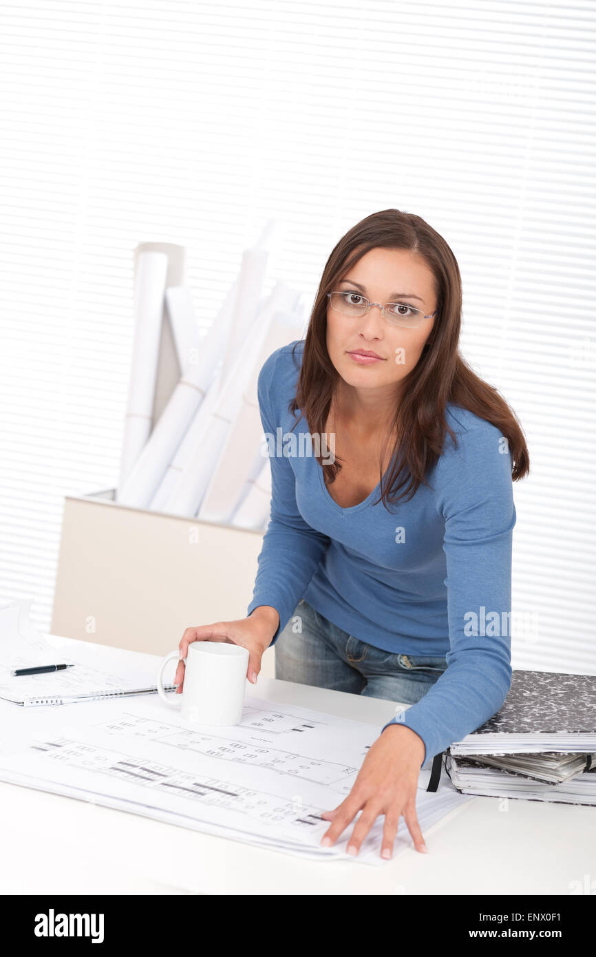 Attractive female architect working at the office Stock Photo - Alamy