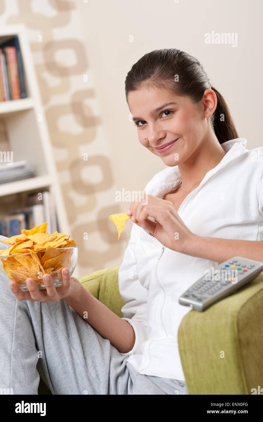 Students - Happy female teenager with potato chips Stock Photo - Alamy