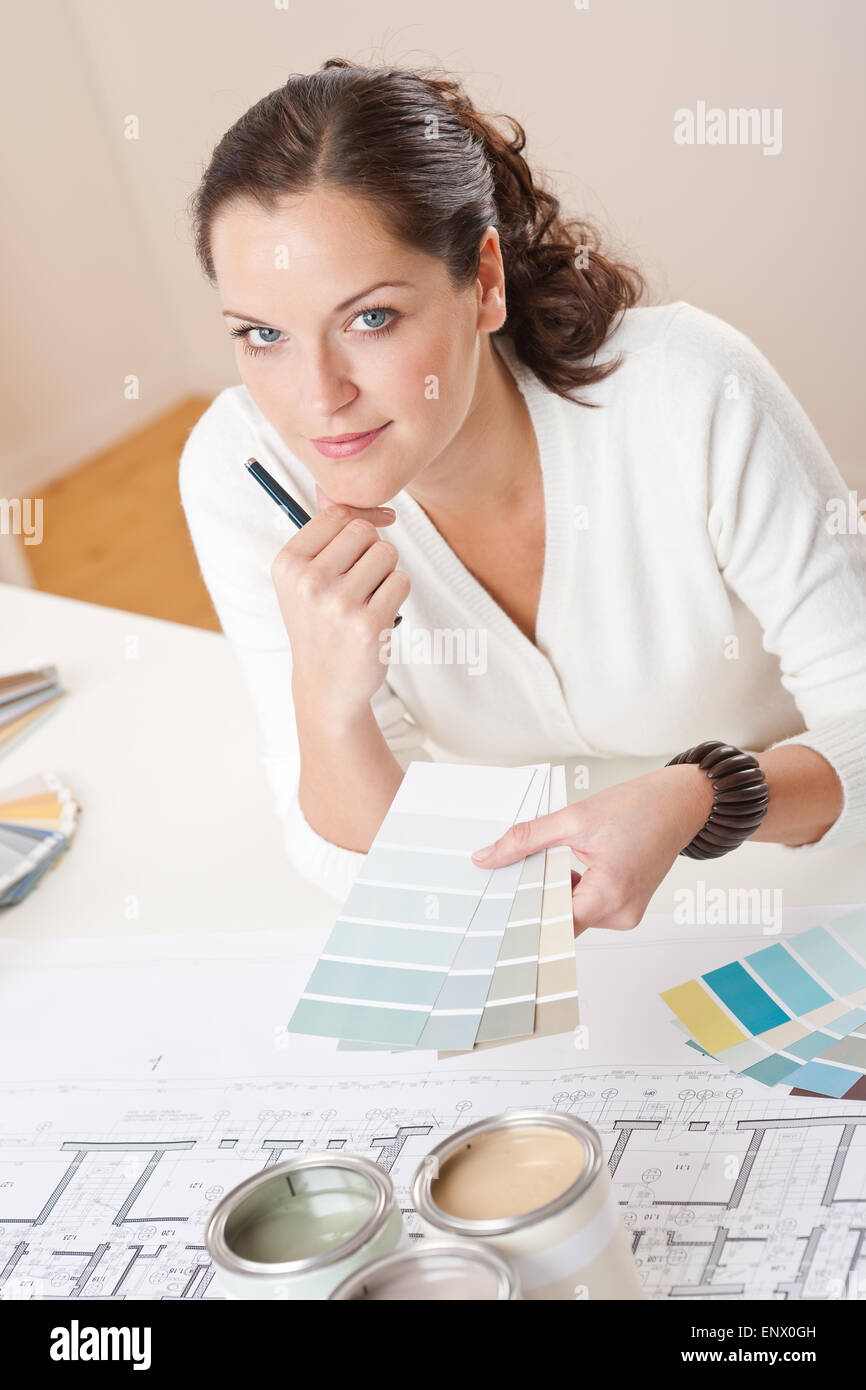 Young female interior designer working at office Stock Photo - Alamy