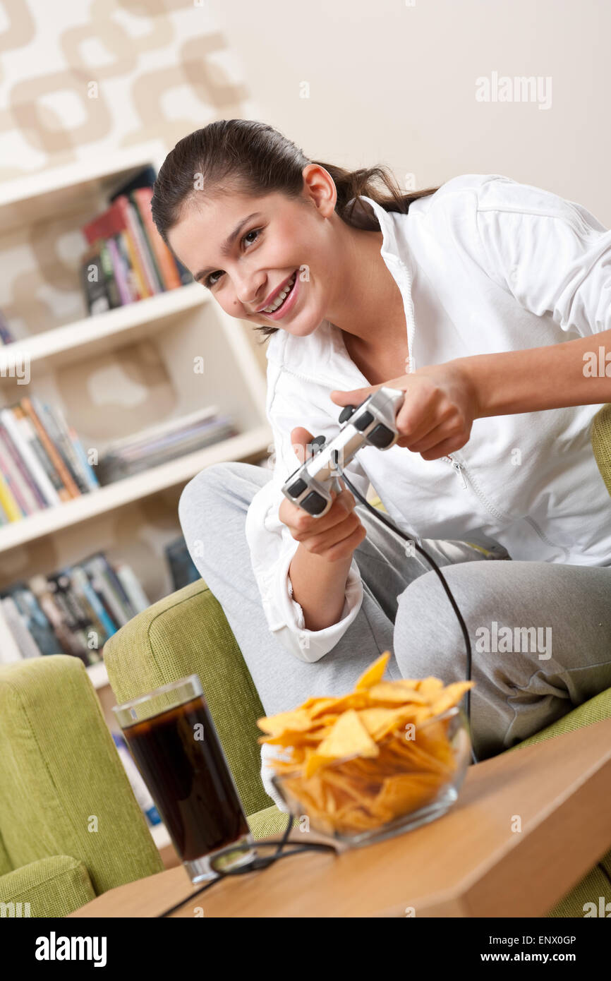 Students - Female teenager playing video game Stock Photo - Alamy