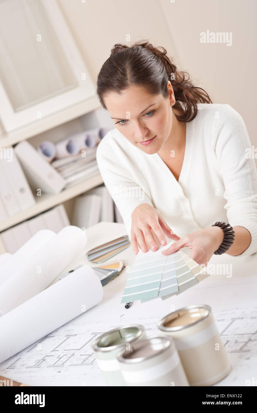 Young female interior designer working at office Stock Photo - Alamy