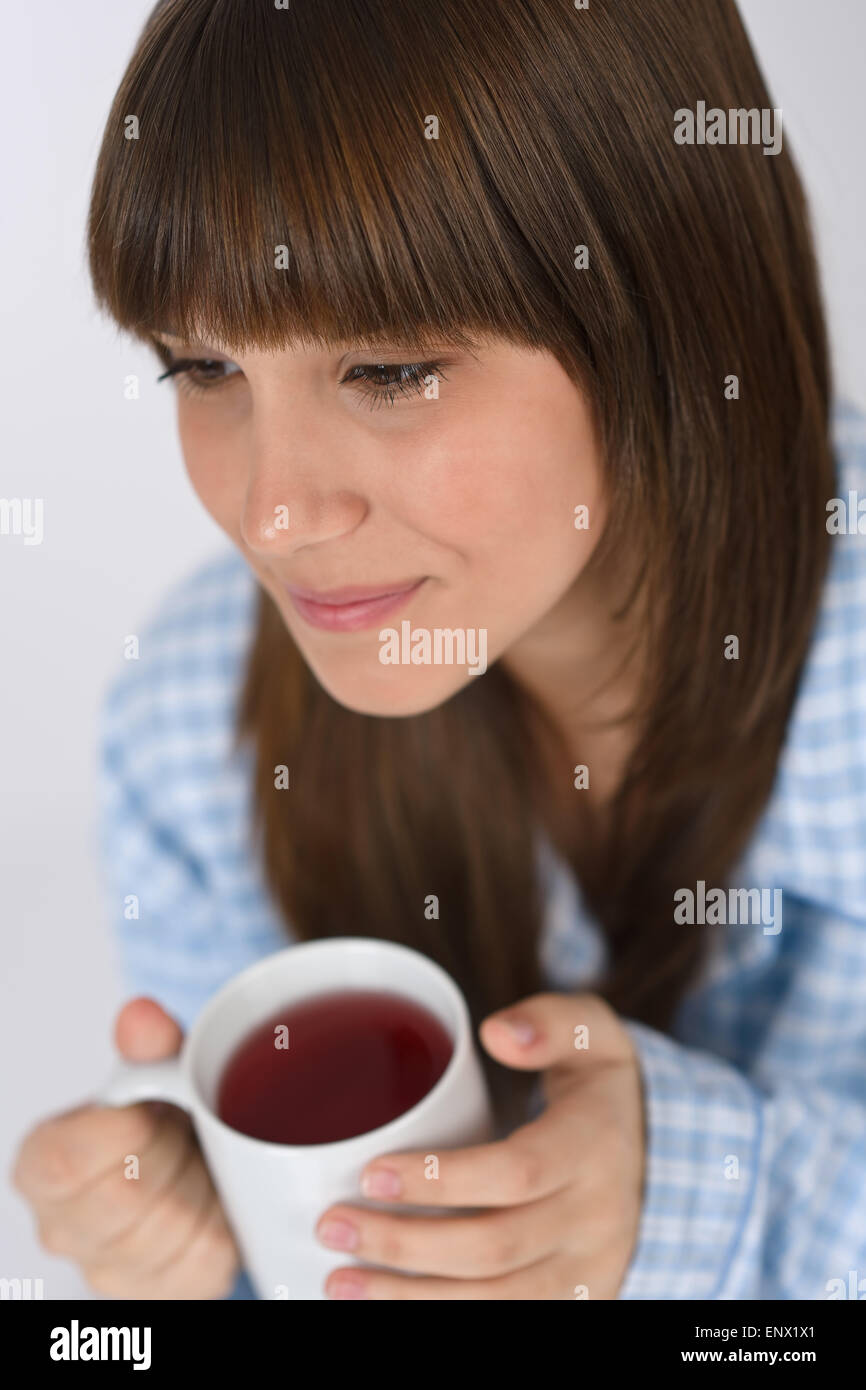 Female teenager with cup of tea for breakfast Stock Photo - Alamy