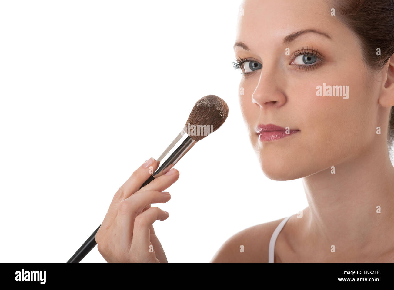 Body care series - Beautiful young woman applying powder Stock Photo ...