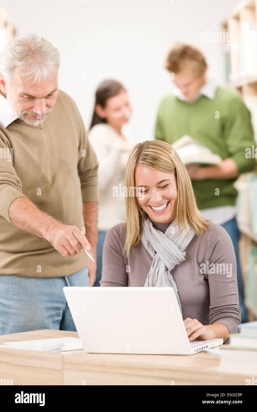 School library - happy student with professor Stock Photo - Alamy