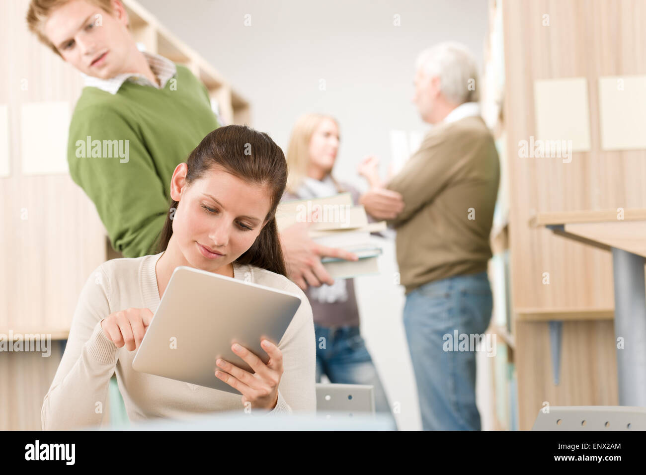 Touch screen tablet computer - students in library Stock Photo - Alamy