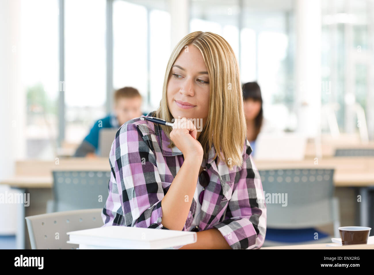 High school - Thoughtful female student in classroom Stock Photo - Alamy