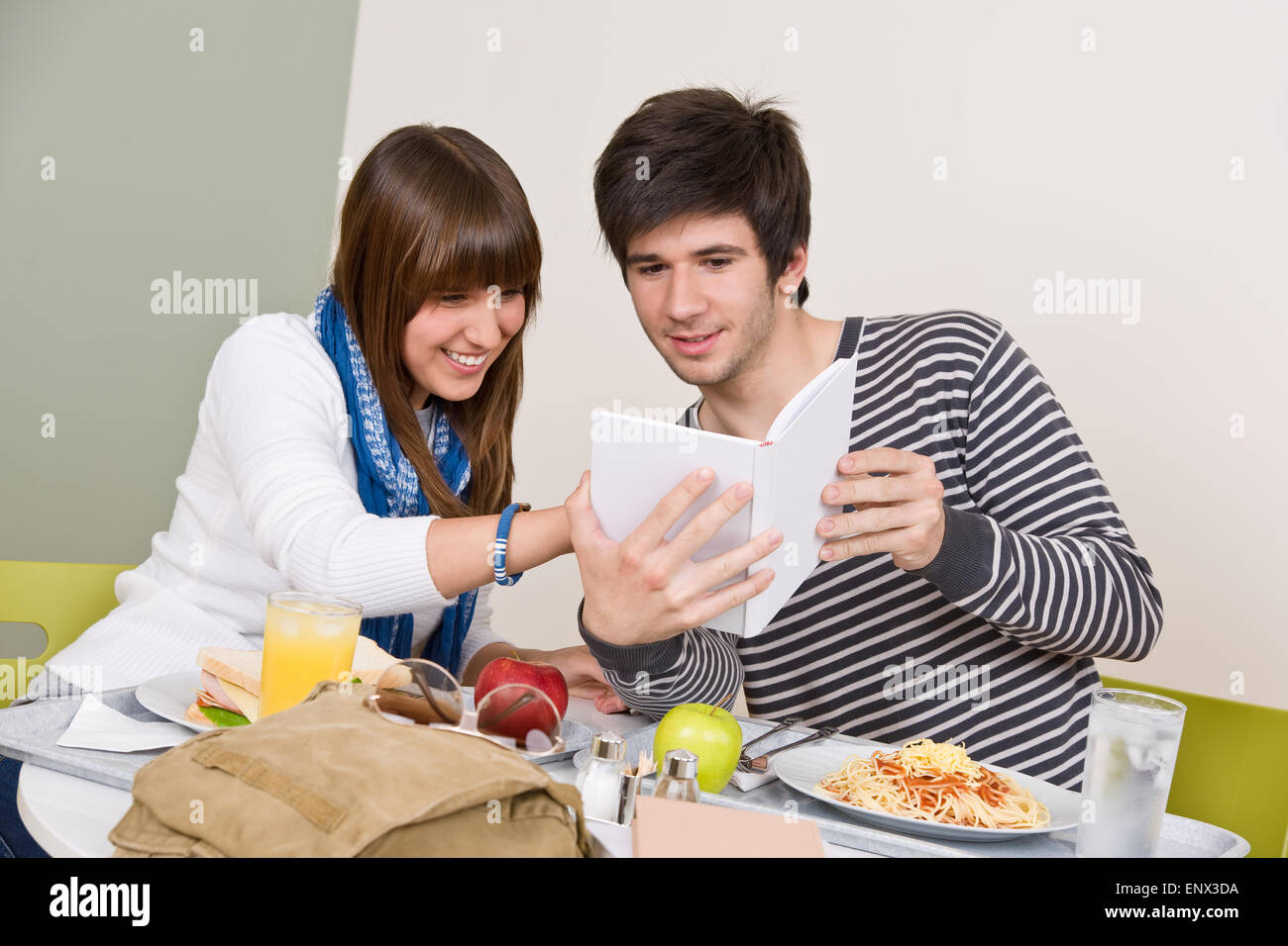 Student cafeteria - Teenagers having lunch break Stock Photo - Alamy