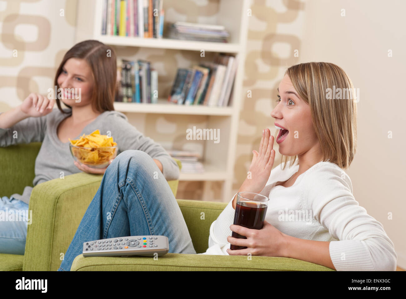 Students - Two female teenager watching television Stock Photo - Alamy