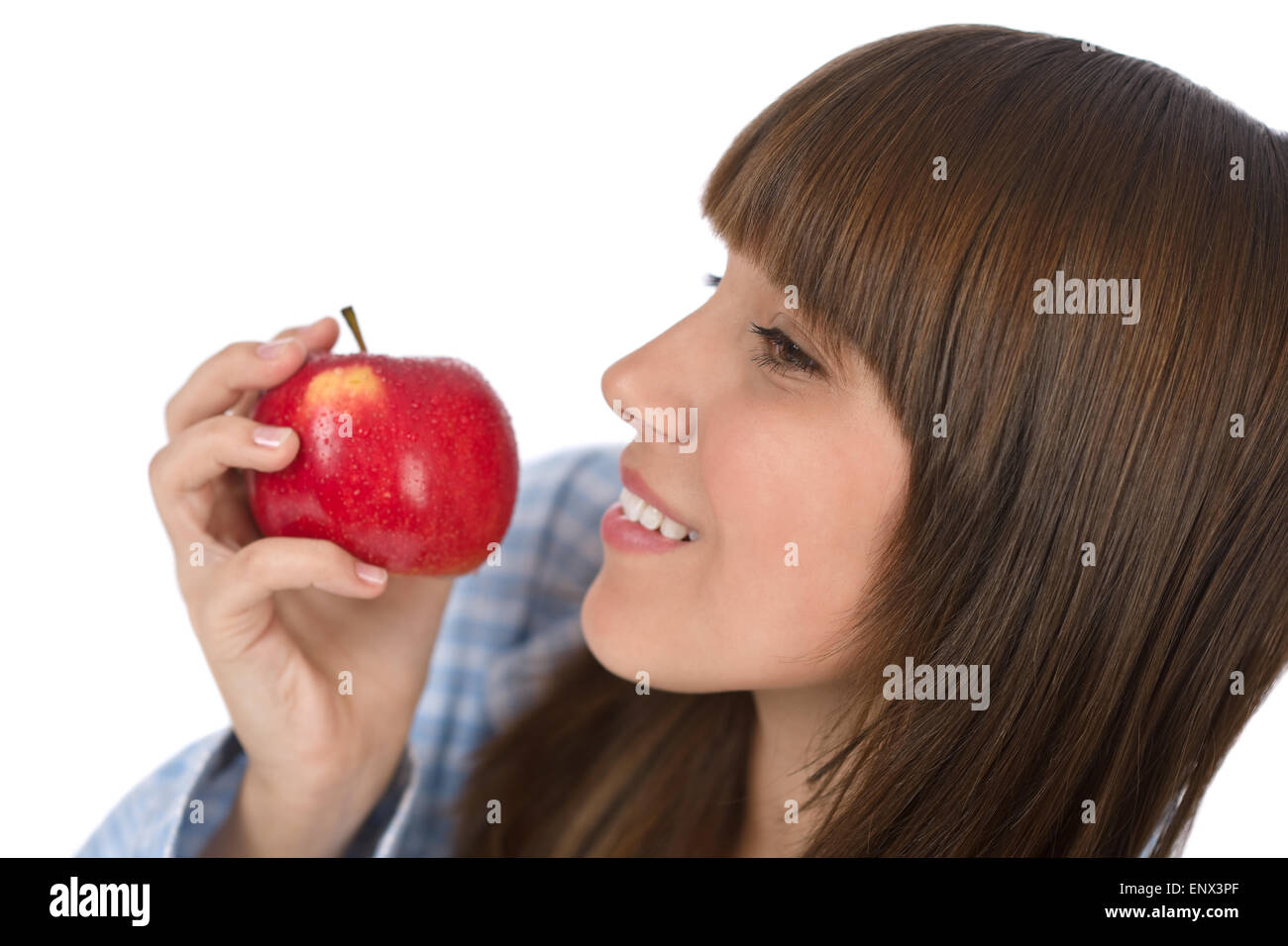 Happy teenager eating healthy apple for breakfast Stock Photo - Alamy
