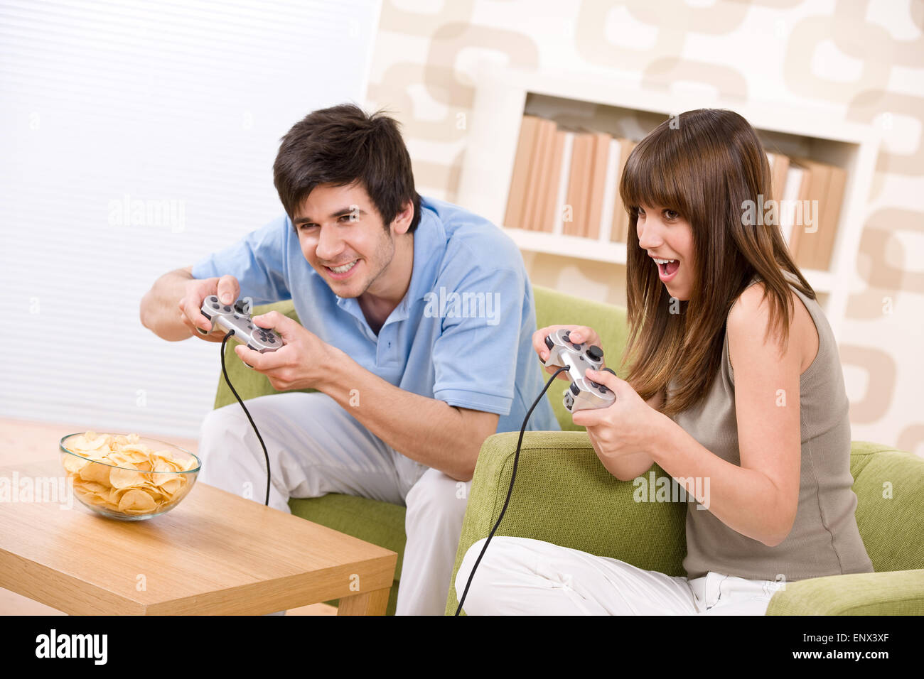 Student - happy teenagers playing video game having fun Stock Photo - Alamy