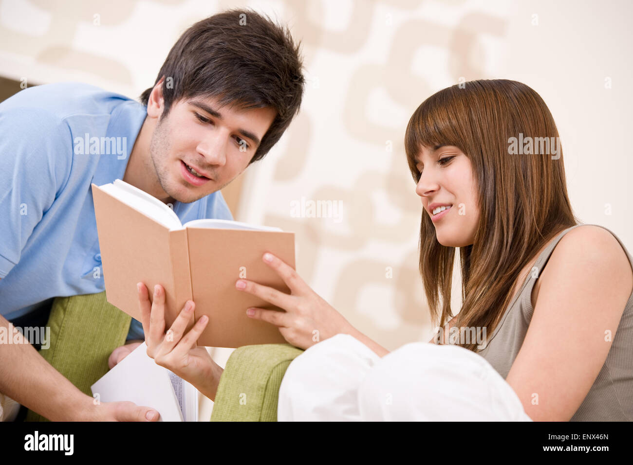 Student - two teenager reading book in lounge Stock Photo - Alamy