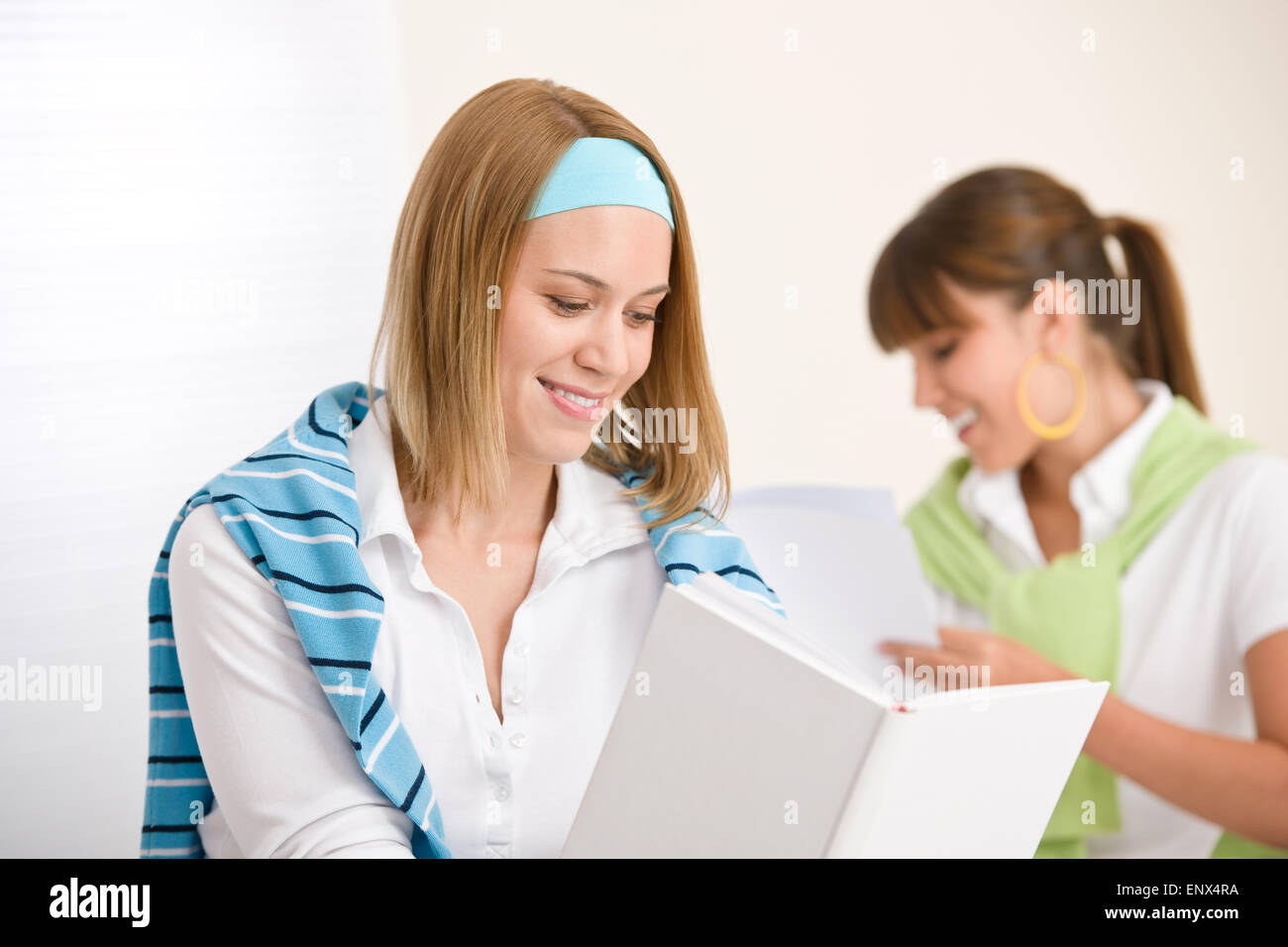 Student at home - two young woman study together Stock Photo - Alamy