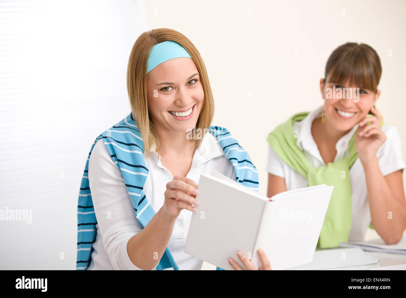 Student at home - two young woman study together Stock Photo - Alamy