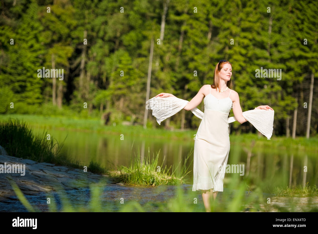 Beautiful romantic woman in summer sunny nature Stock Photo - Alamy