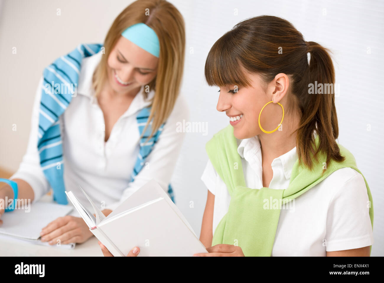 Student at home - two young woman study together Stock Photo - Alamy