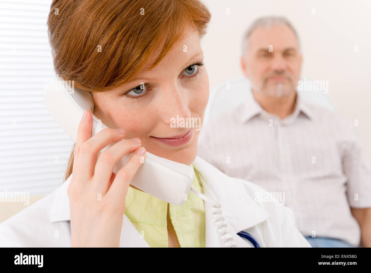 Doctor office - female physician make phone call Stock Photo - Alamy