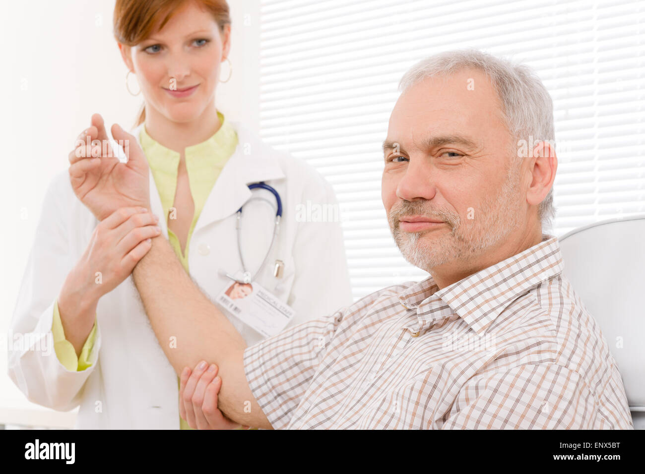 Doctor office - female physician examine patient Stock Photo - Alamy