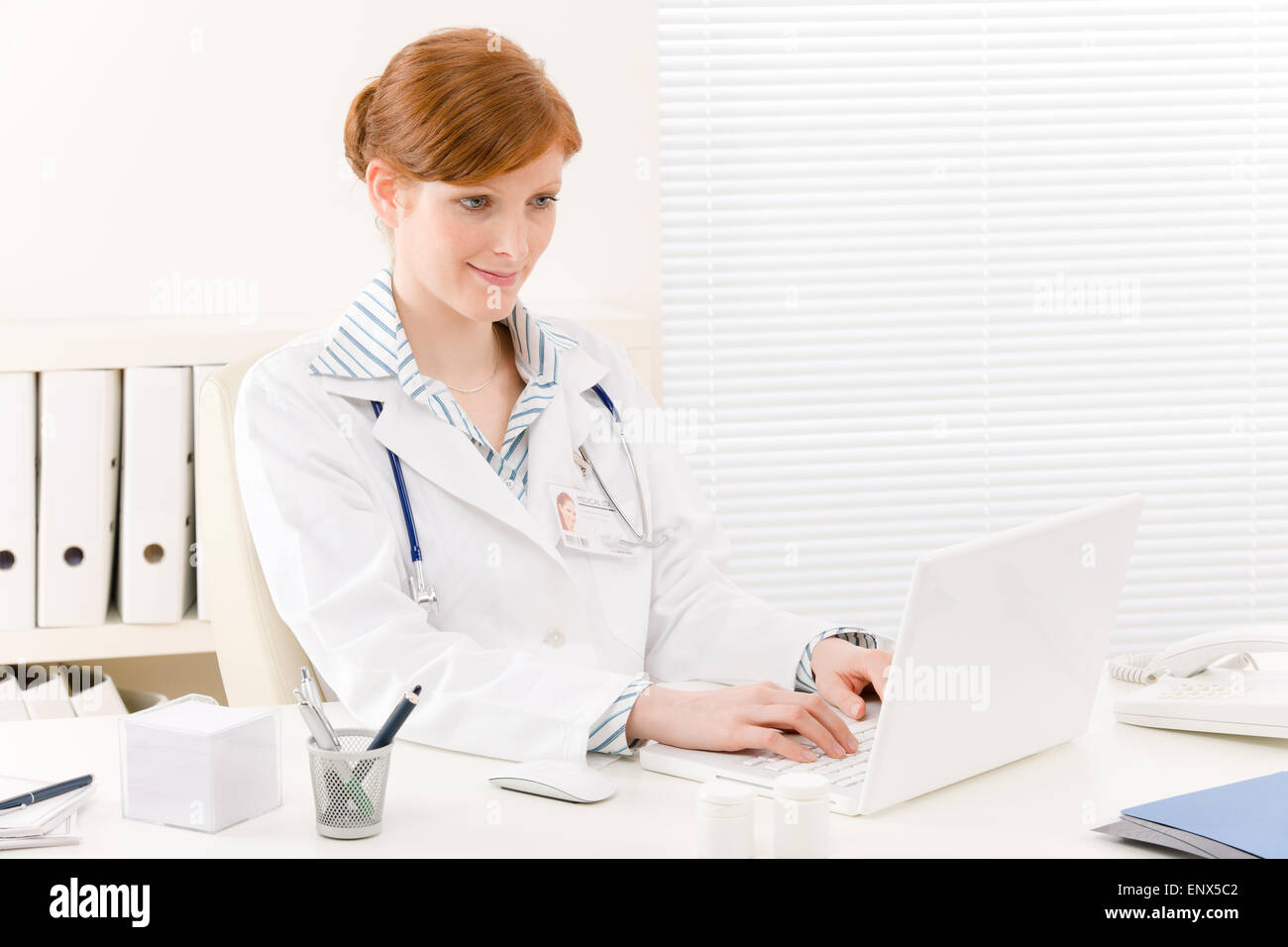 Doctor office - female physician work computer Stock Photo - Alamy