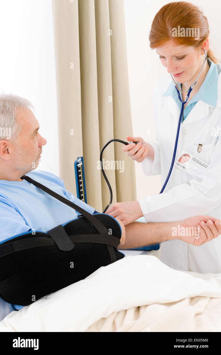 Hospital - doctor check blood pressure patient Stock Photo - Alamy