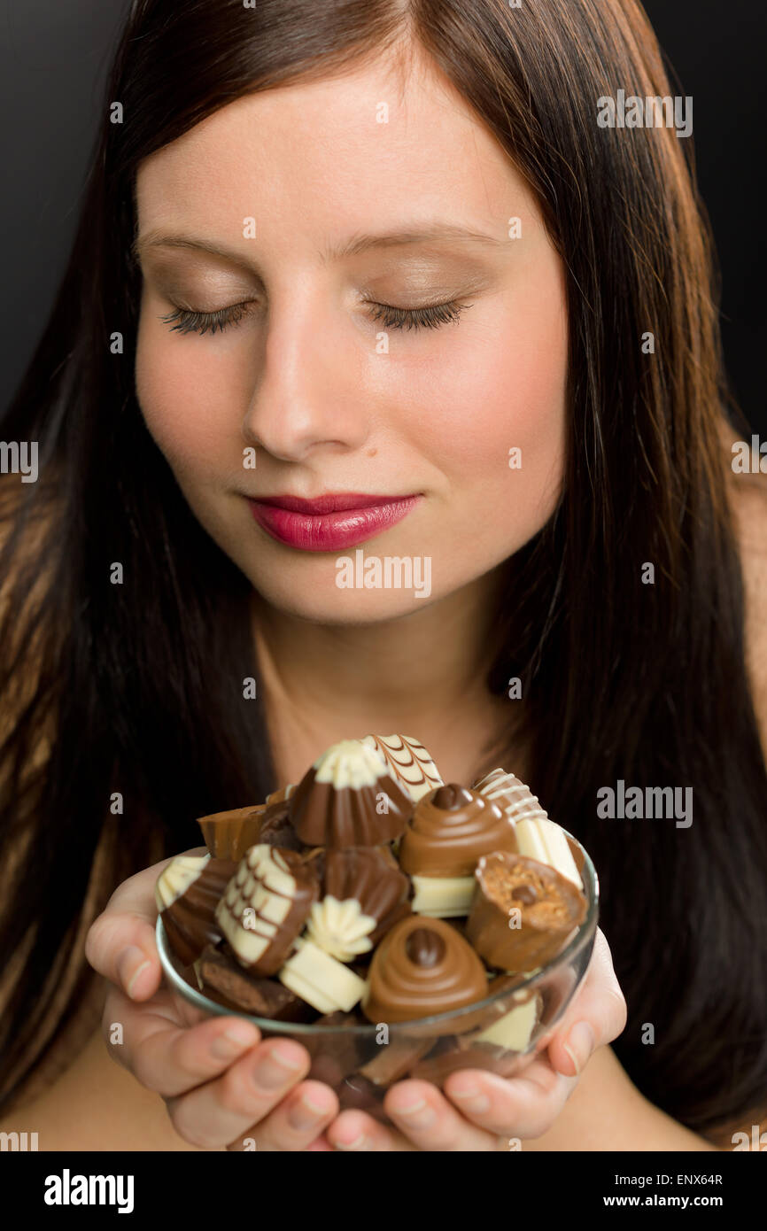Chocolate - portrait young healthy woman enjoy candy Stock Photo - Alamy