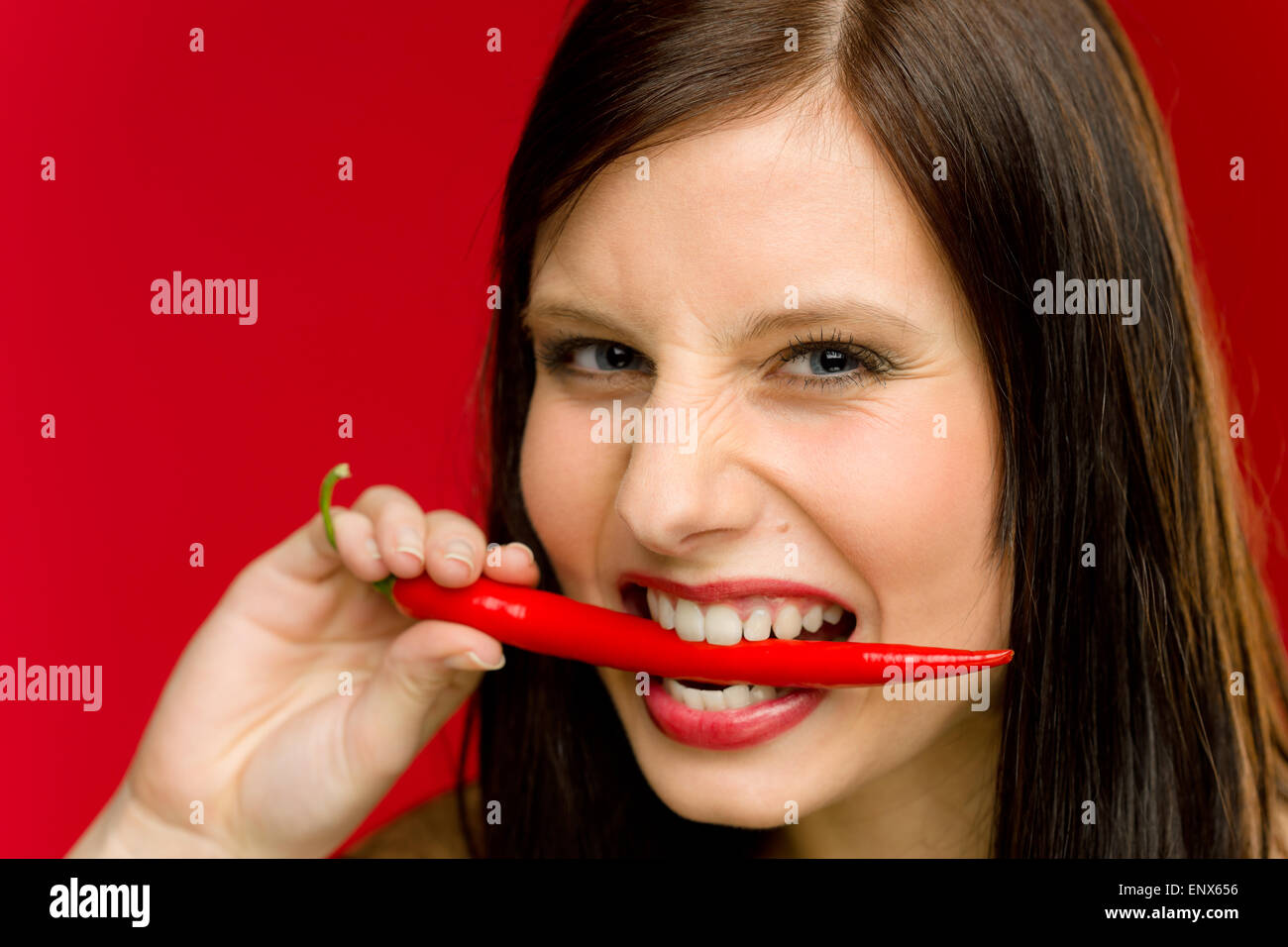 Hot chili pepper bite hi-res stock photography and images - Alamy