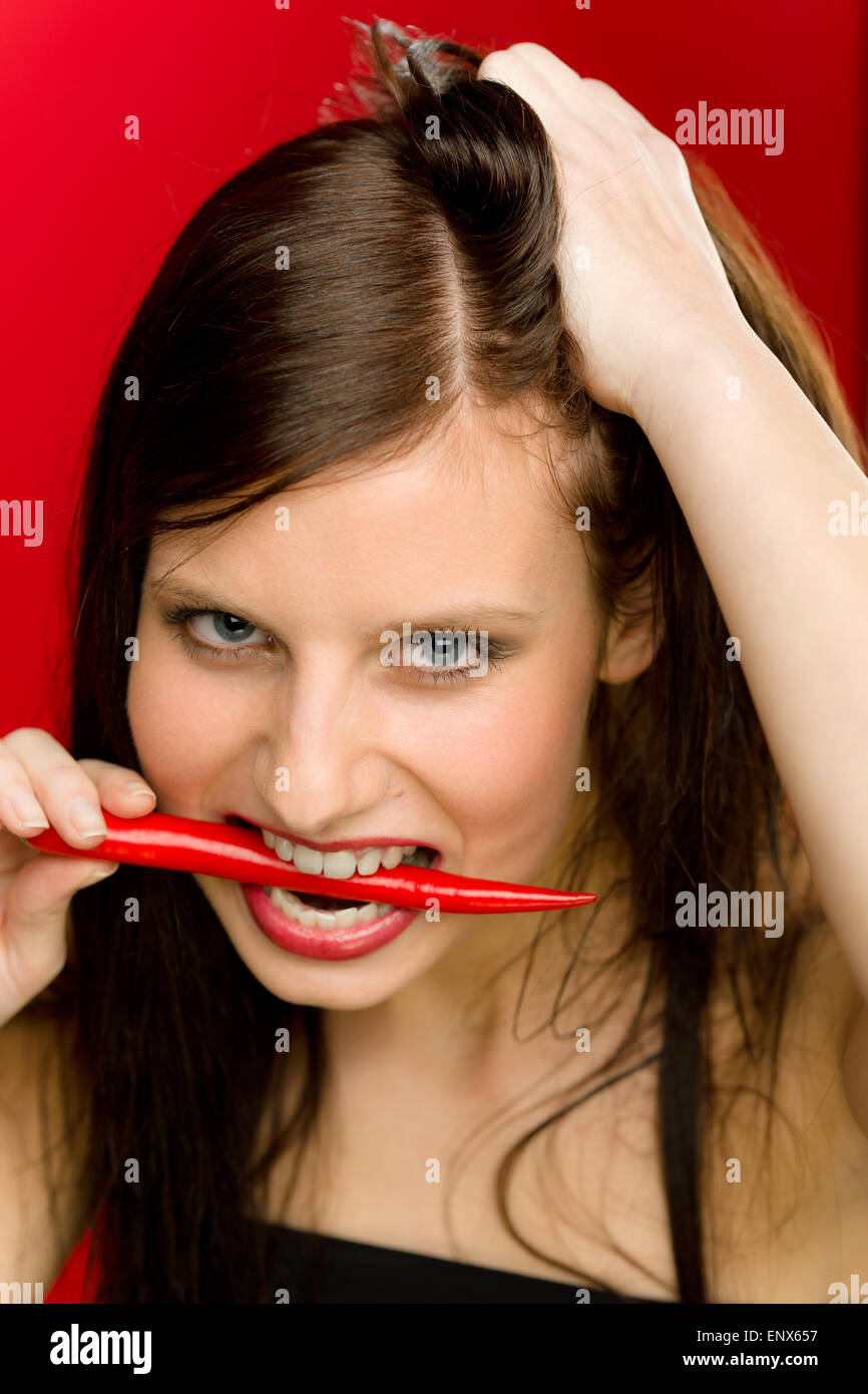 Hot chili pepper bite hi-res stock photography and images - Alamy