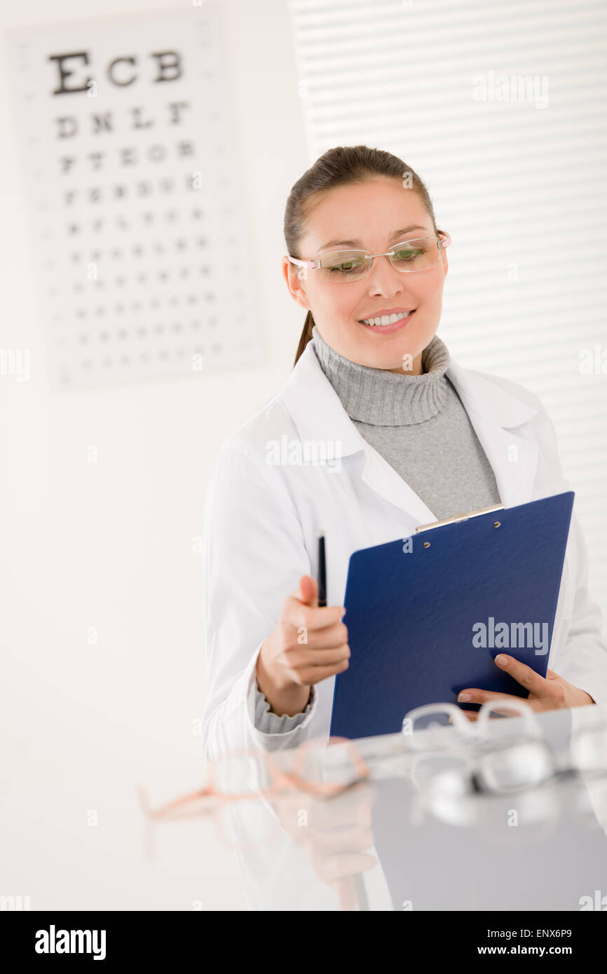 Optician doctor woman with glasses and eye chart Stock Photo - Alamy
