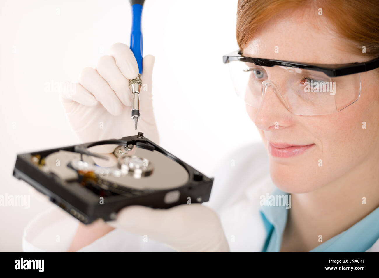 Female computer engineer - woman repair hard disc Stock Photo - Alamy